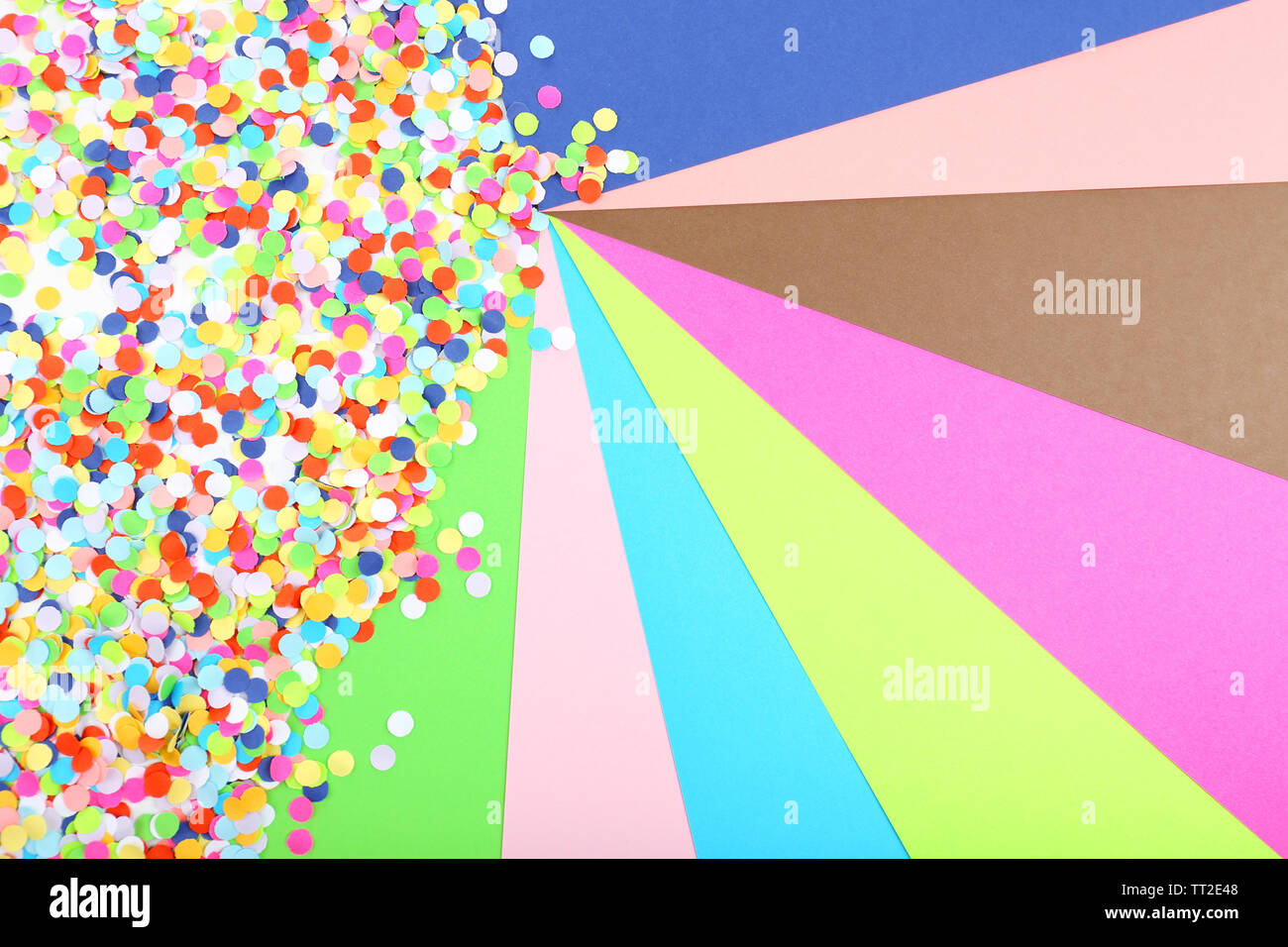 Confetti on colorful background Stock Photo - Alamy