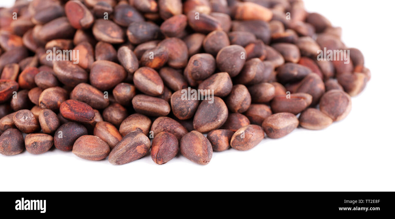 Cedar pine nuts isolated on white Stock Photo - Alamy