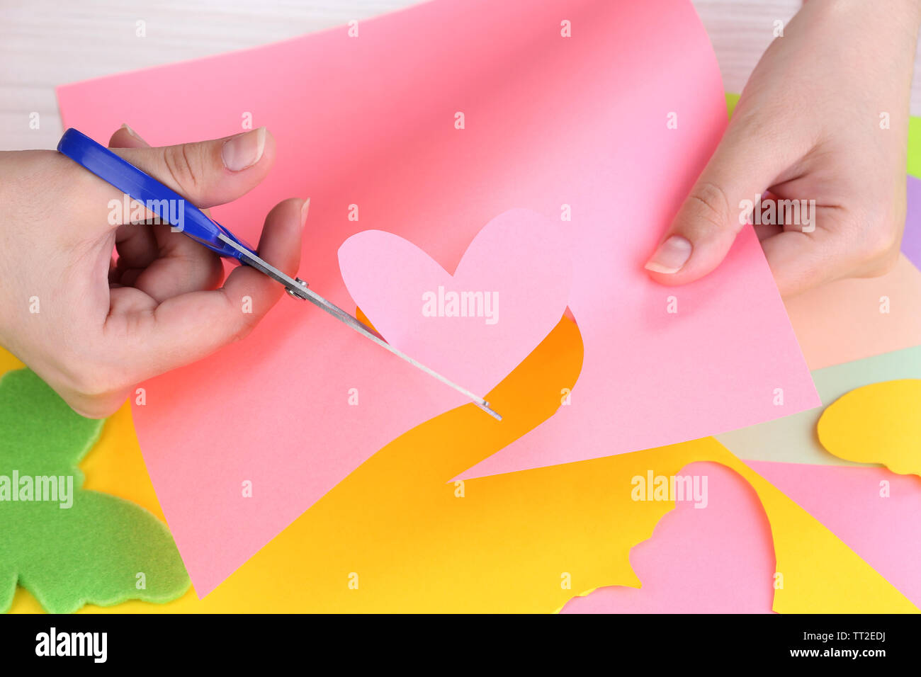 Women hand cutting colorful paper with scissors Stock Photo - Alamy