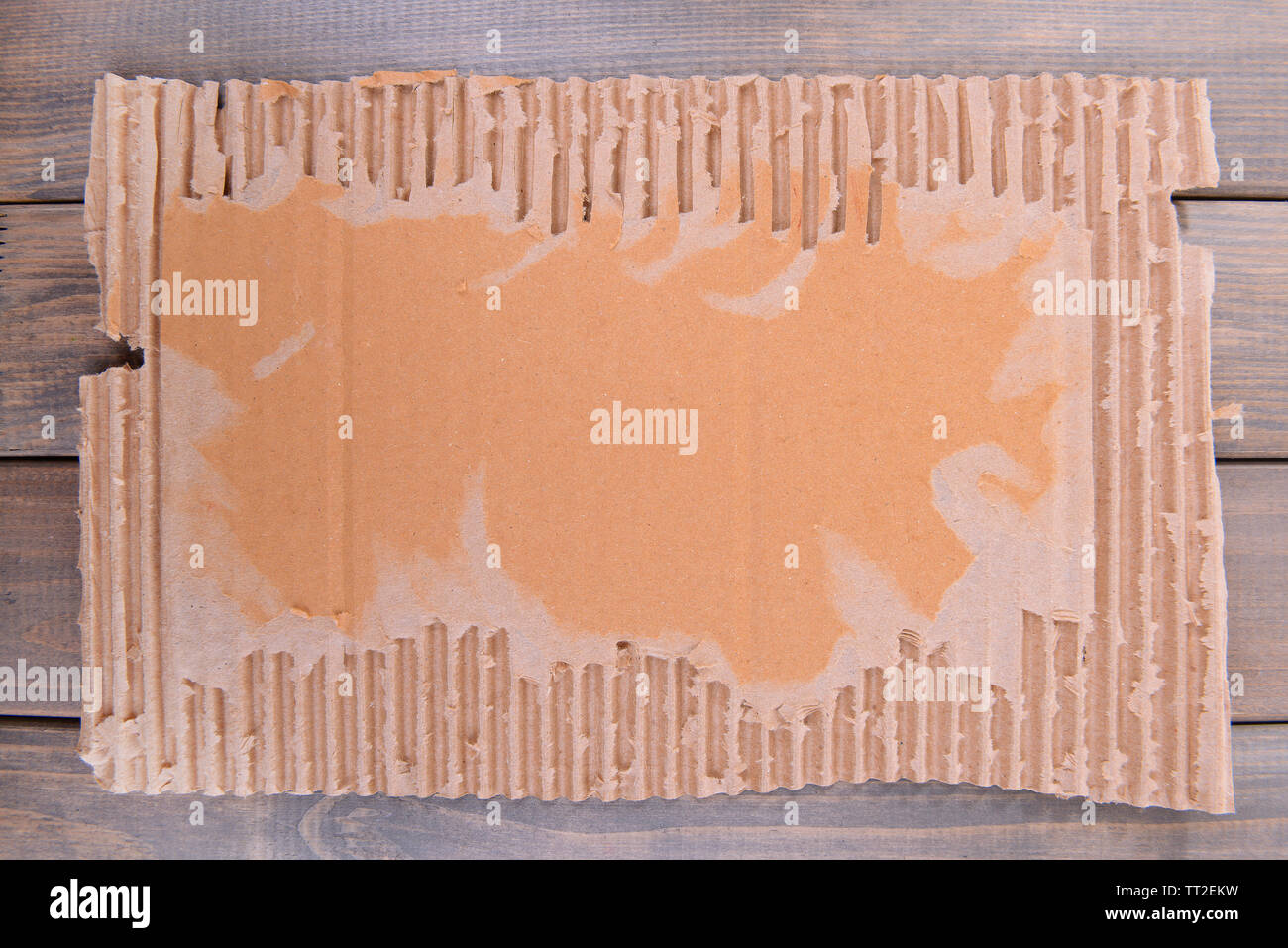 Cardboard on wooden background Stock Photo - Alamy