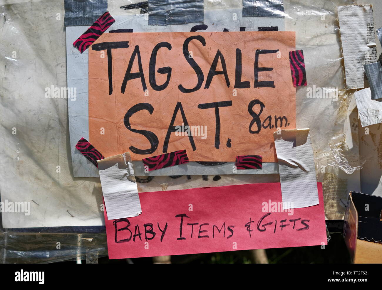 Sign advertising a local tag sale Stock Photo - Alamy