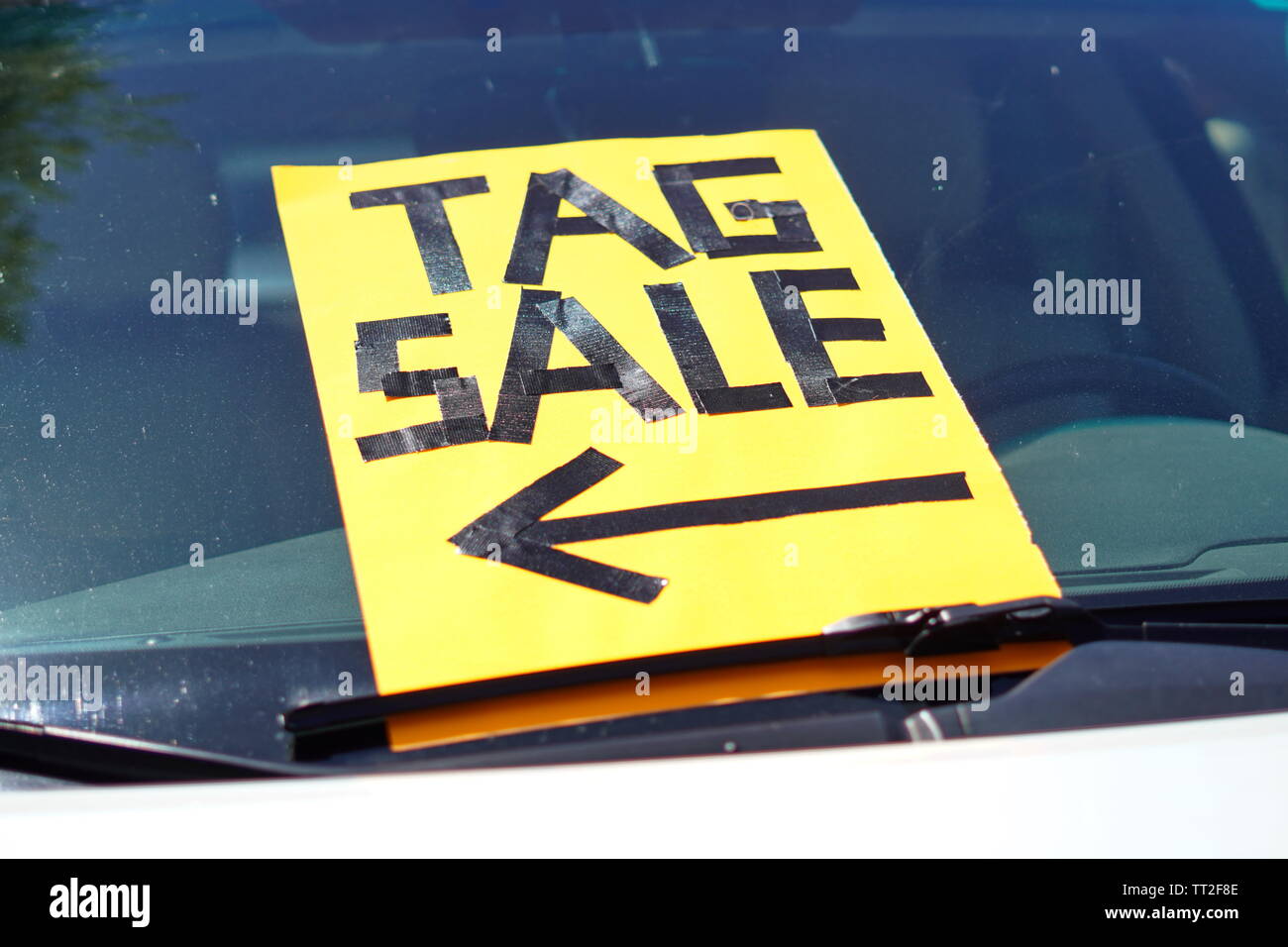 Sign advertising a local tag sale Stock Photo - Alamy