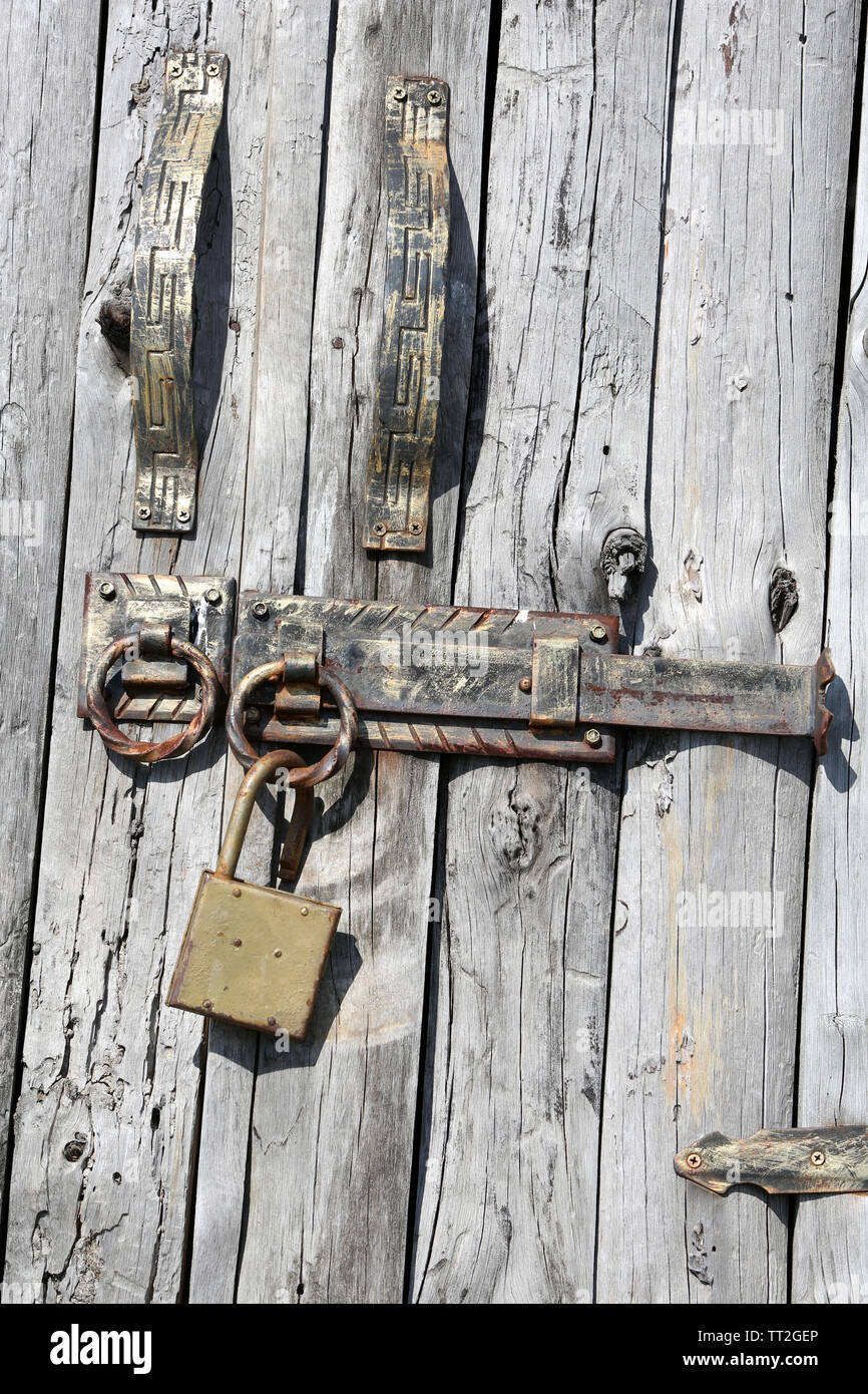 Wooden door with big lock Stock Photo - Alamy