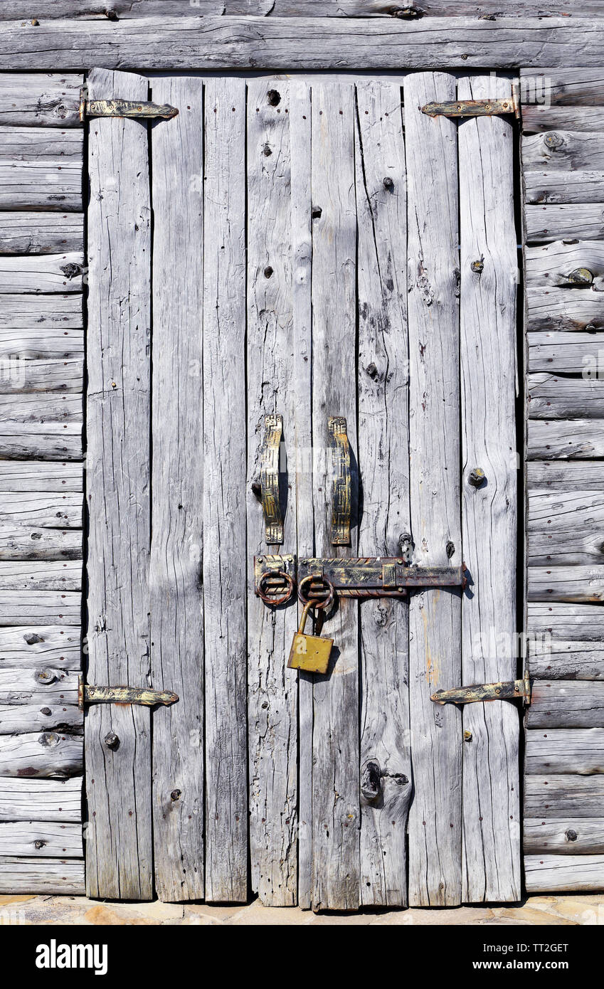 Wooden door with big lock Stock Photo - Alamy