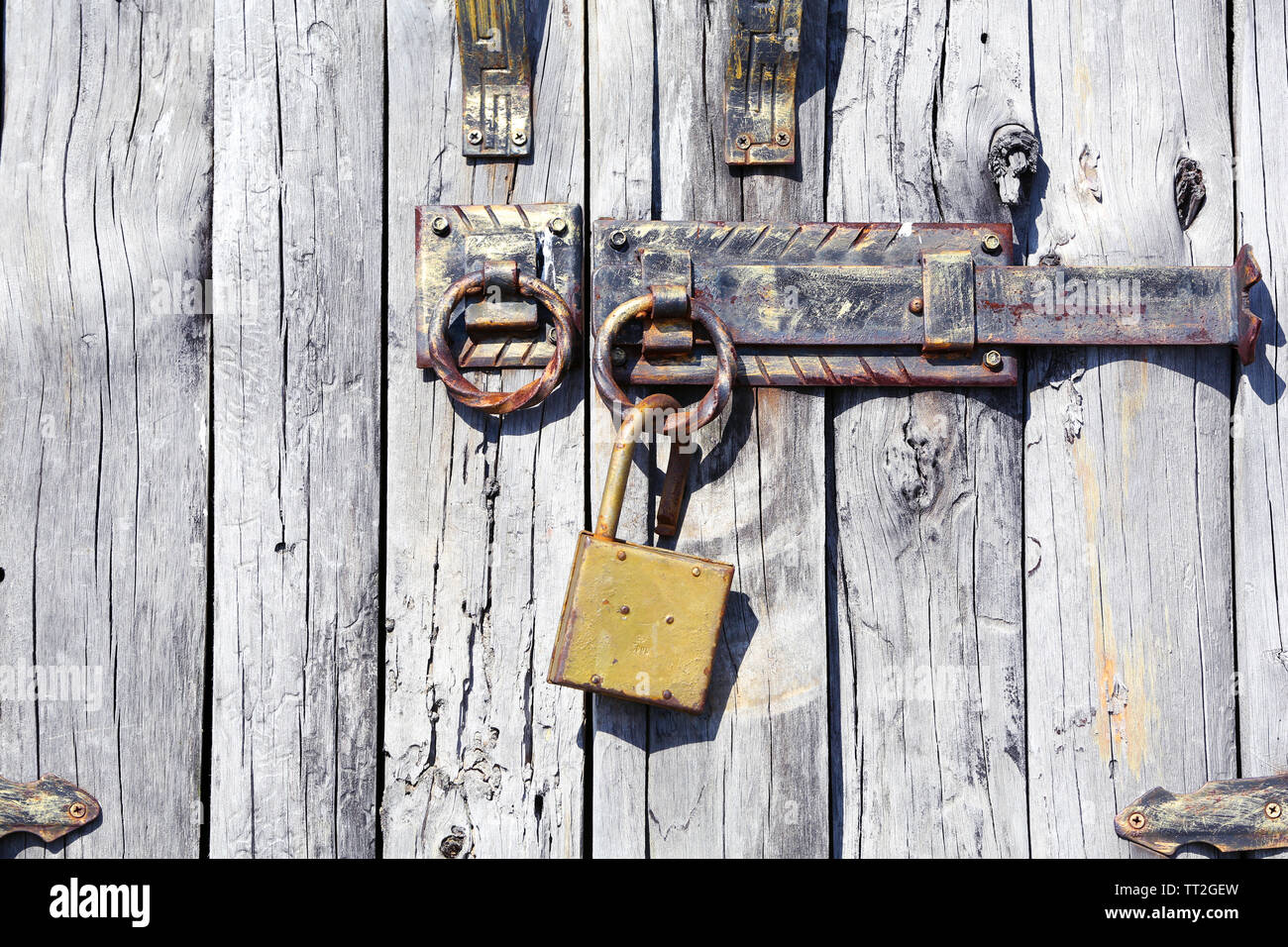 Wooden door with big lock Stock Photo - Alamy
