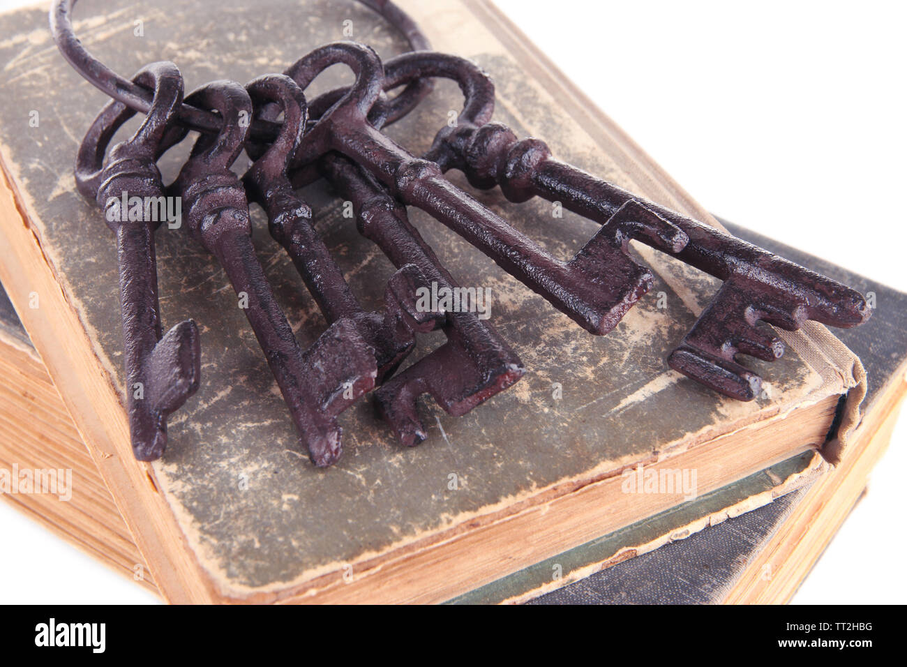 Old keys on old books close up Stock Photo - Alamy