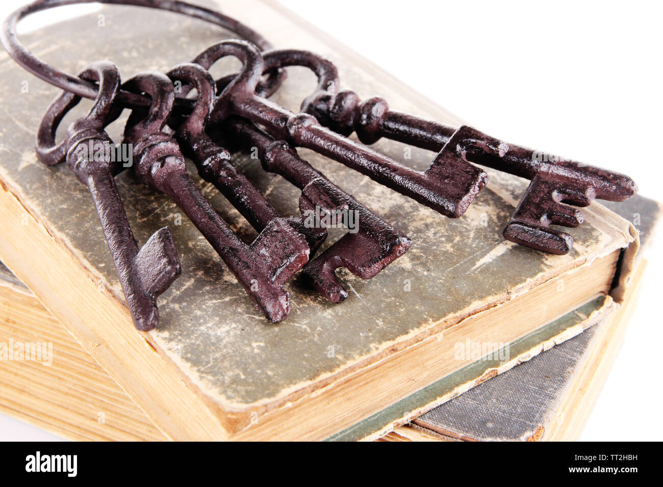 Old keys on old books close up Stock Photo - Alamy