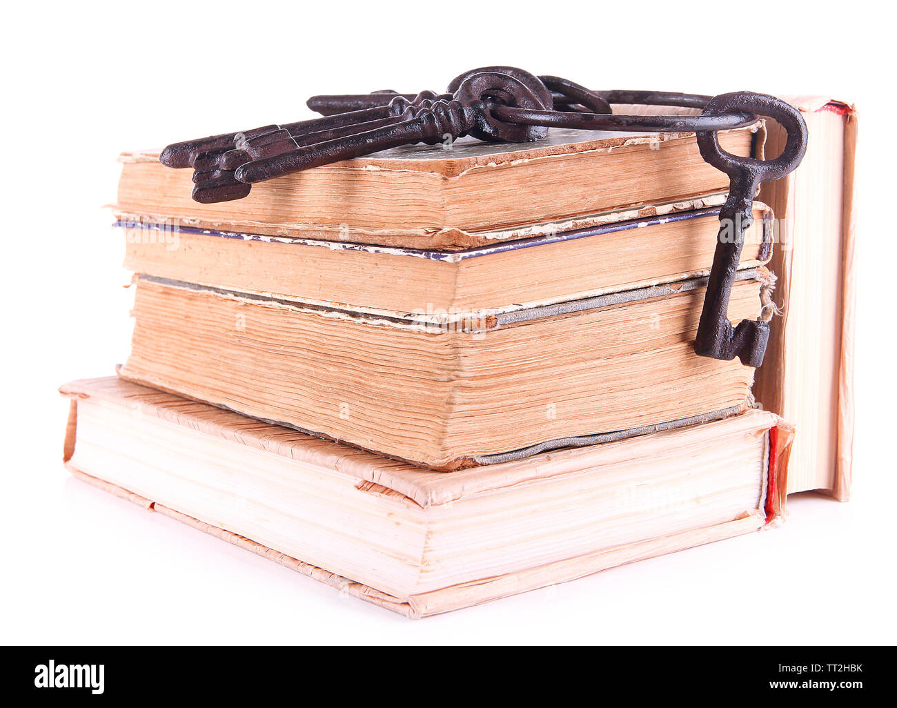 Old keys on old books isolated on white Stock Photo - Alamy