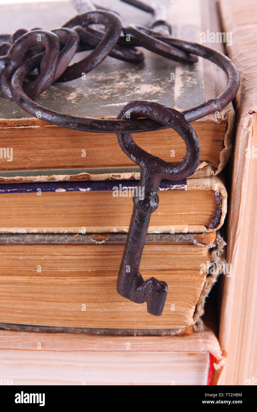 Old keys on old books close up Stock Photo - Alamy