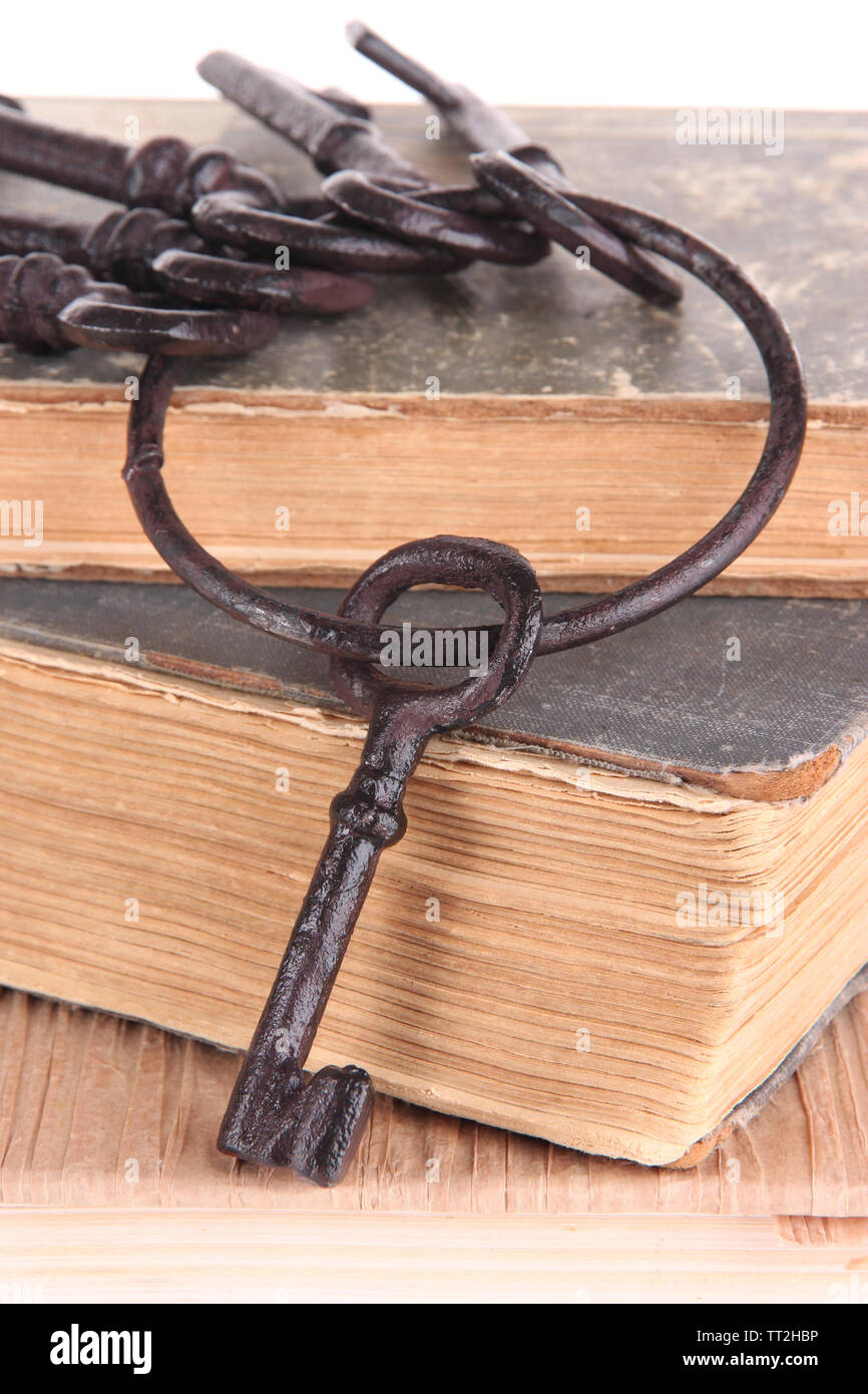 Old keys on old books close up Stock Photo - Alamy