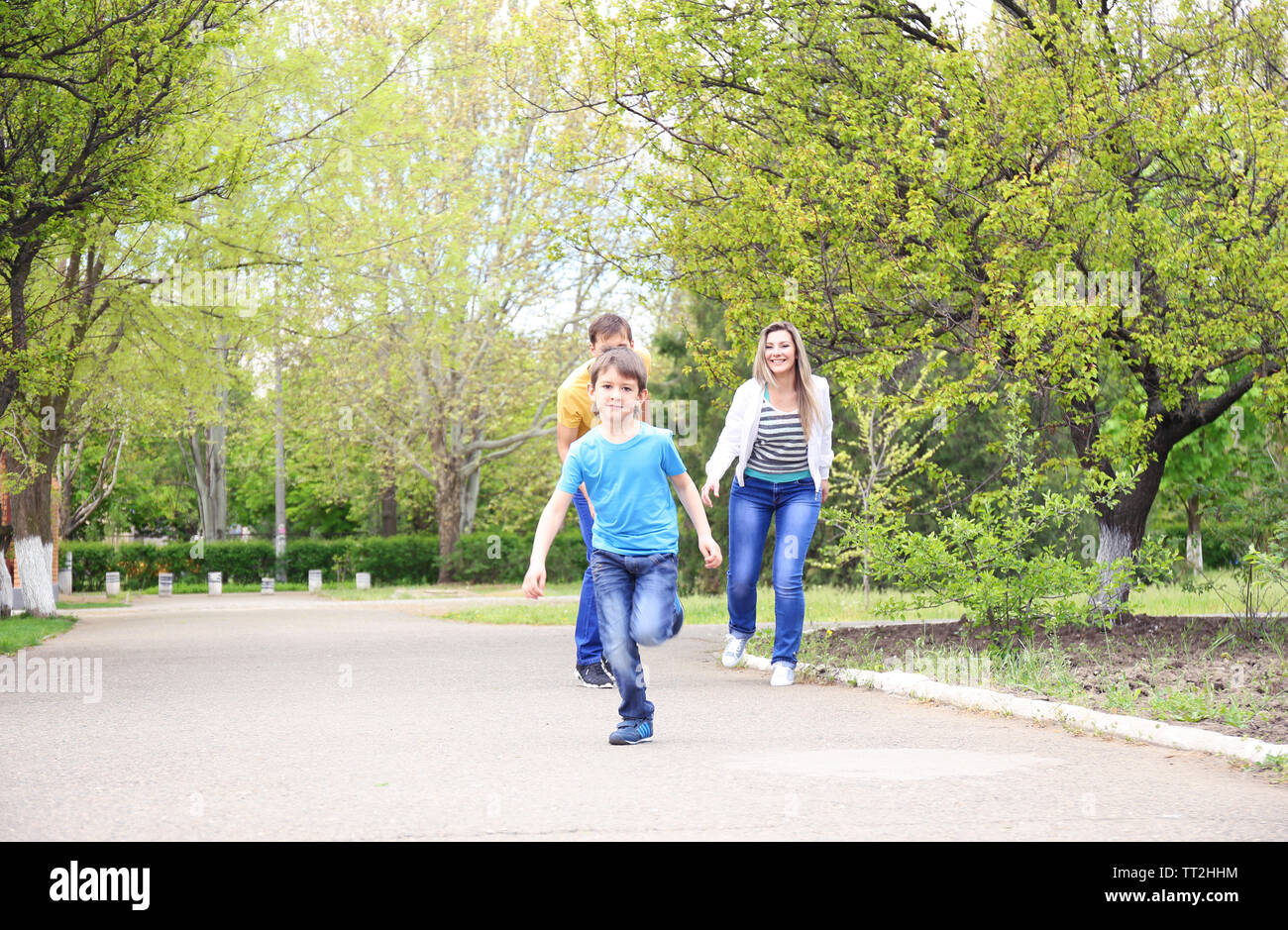 Family walk sunny day father mother happy park hi-res stock photography ...