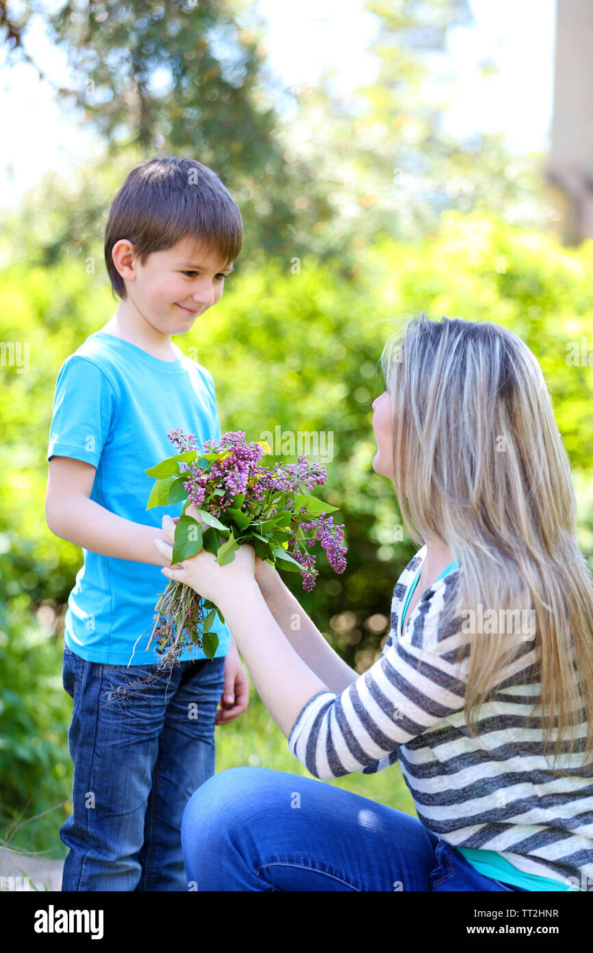 Happy mom and son in the park Stock Photo - Alamy