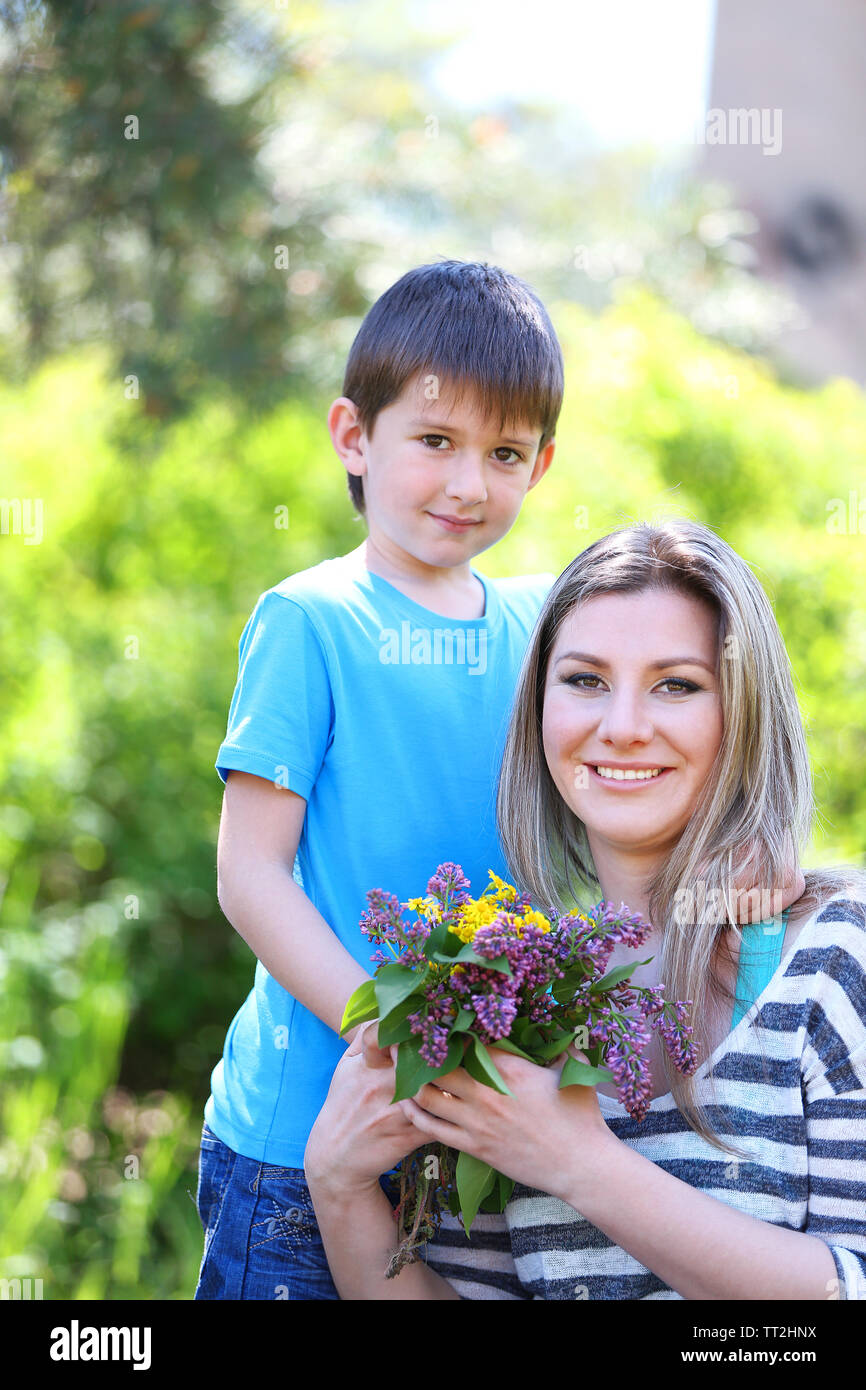 Happy mom and son in the park Stock Photo - Alamy