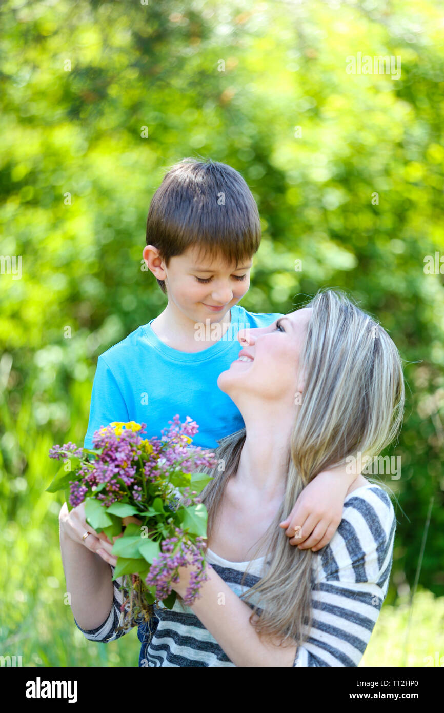 Happy mom and son in the park Stock Photo - Alamy