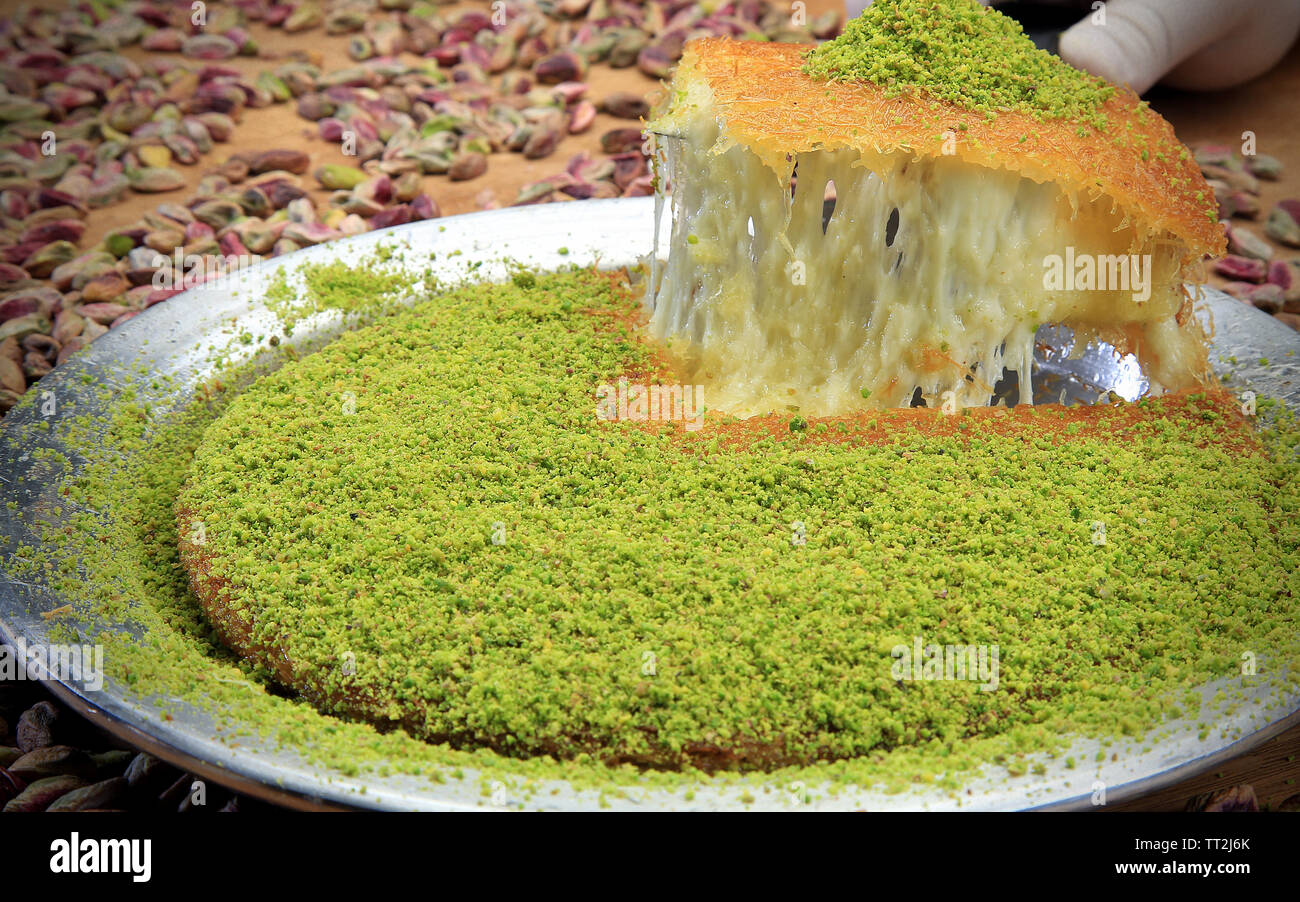 kunefe called turkish cheese pistachio dessert Stock Photo - Alamy