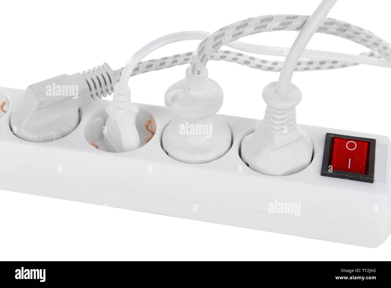 Many plugs plugged into electric power bar close-up Stock Photo - Alamy