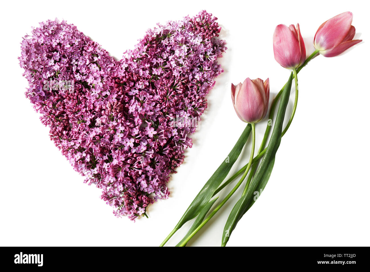 Beautiful heart of flowers isolated on white Stock Photo - Alamy
