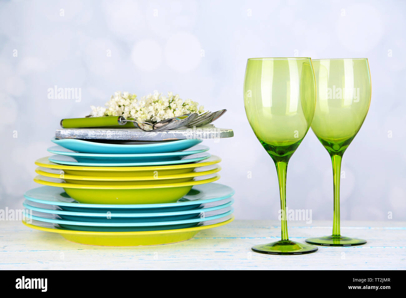Color table settings, on table, on light background Stock Photo - Alamy
