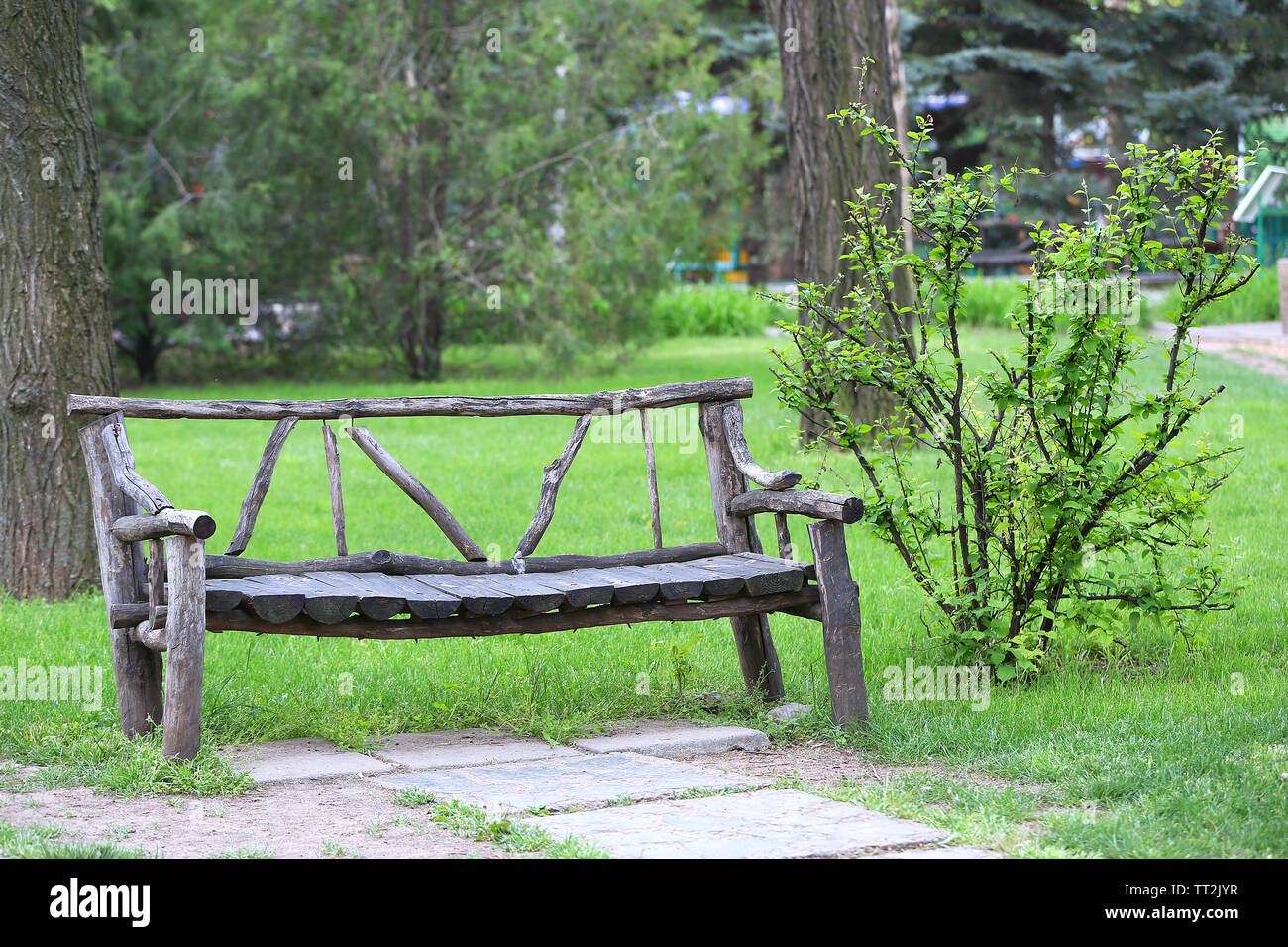 Wooden bench at park Stock Photo - Alamy