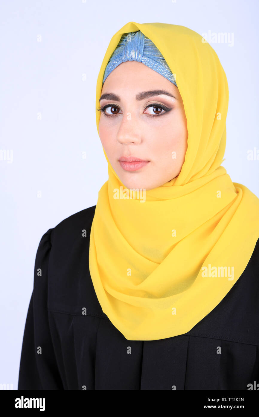 Beautiful muslim arabic woman on grey background Stock Photo - Alamy