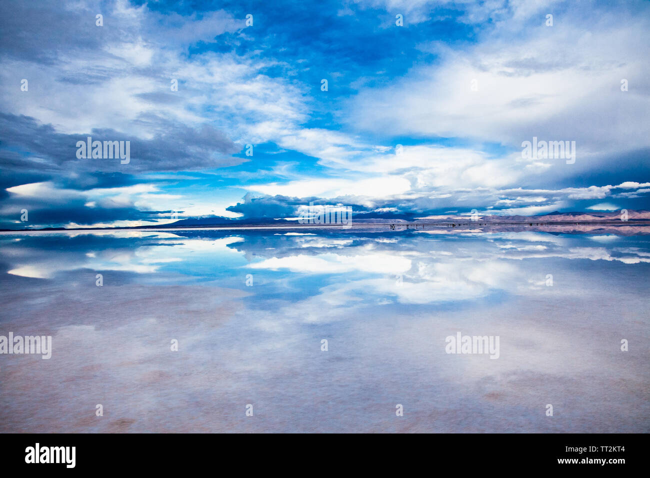 The Salar de Uyuni flooded after the rains, Bolivia. Clouds reflected ...