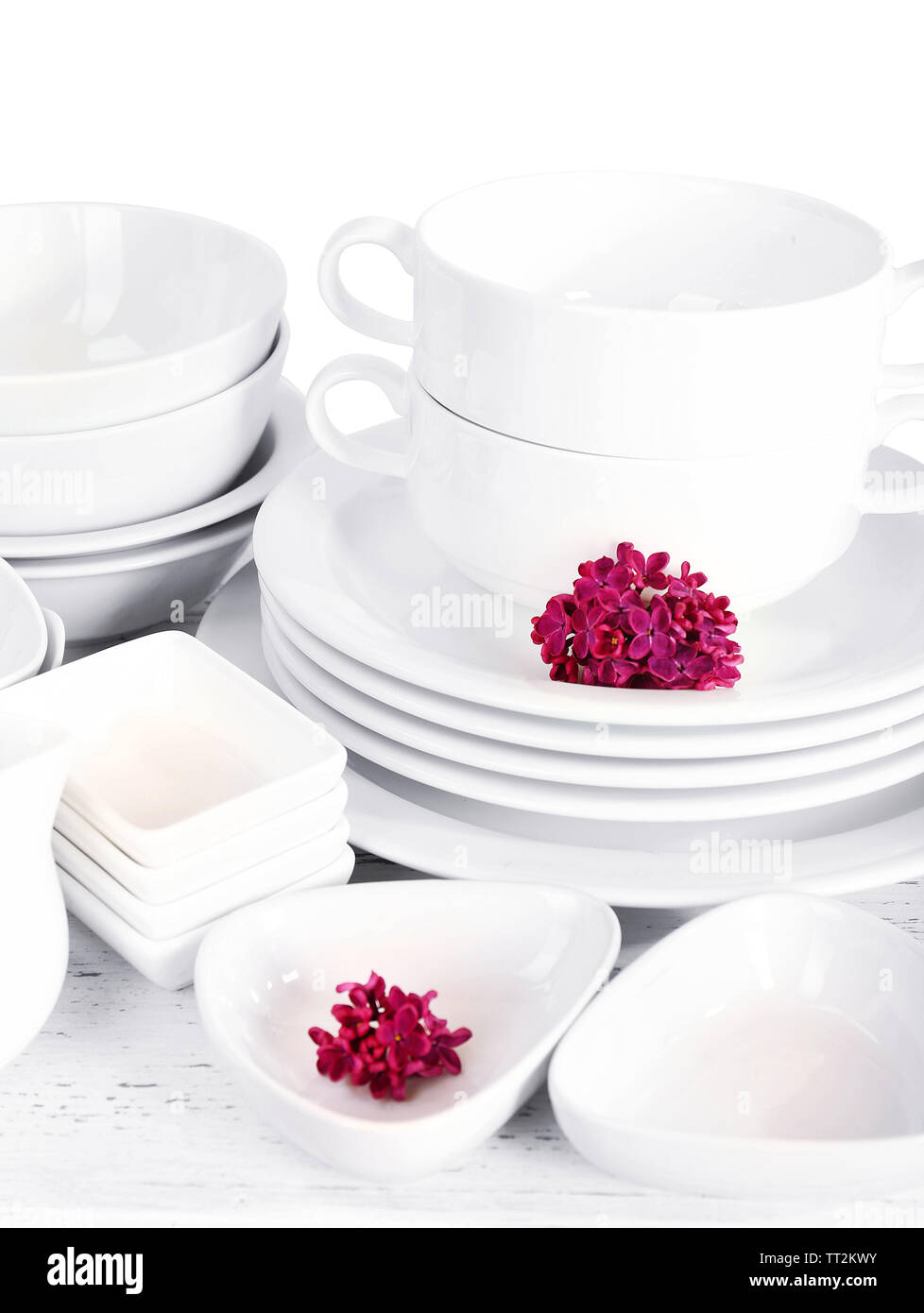Different tableware on shelf, isolated on white Stock Photo - Alamy