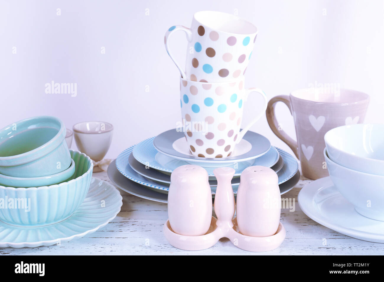 Different tableware on shelf, isolated on white Stock Photo - Alamy