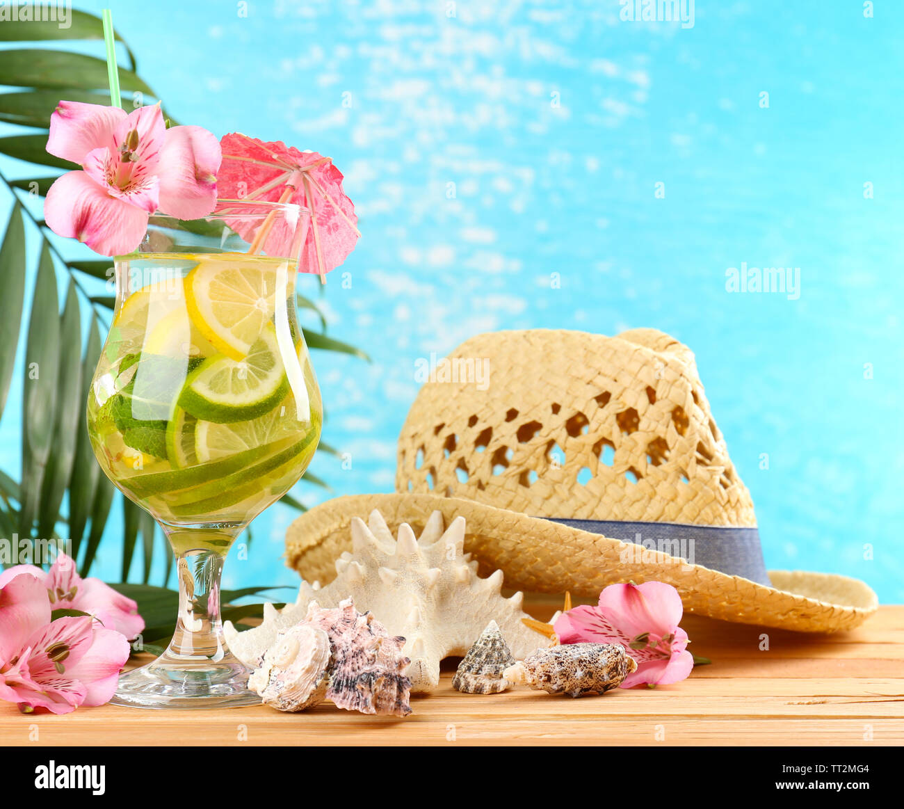 Refreshing cocktail on beach table Stock Photo - Alamy