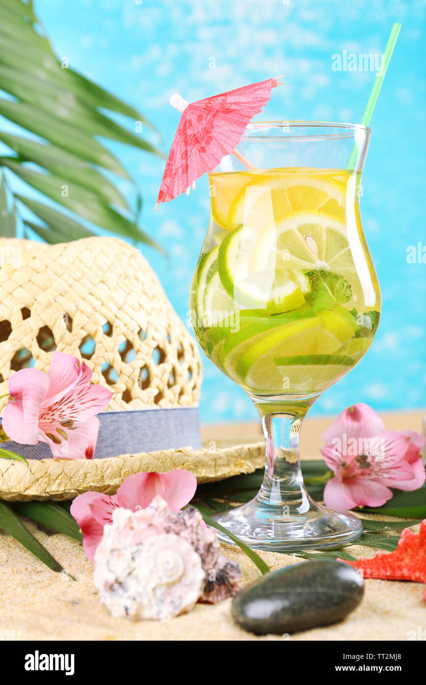Refreshing cocktail on sand beach Stock Photo - Alamy