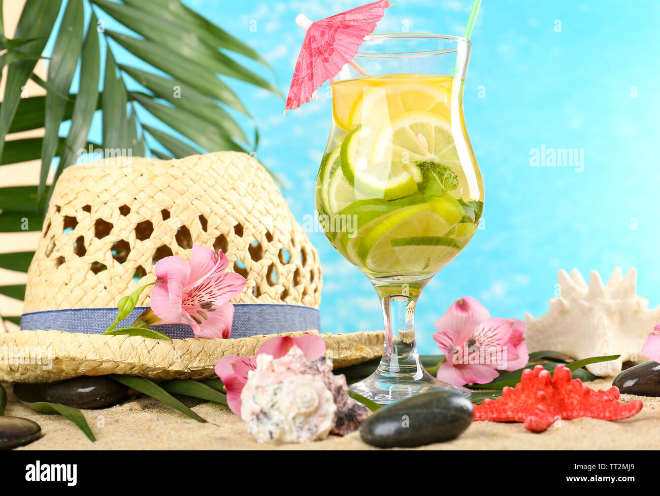 Refreshing cocktail on sand beach Stock Photo - Alamy