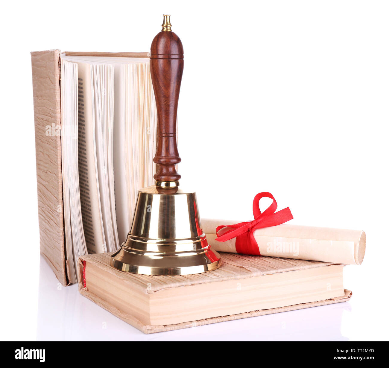 Gold retro school bell with scroll and books isolated on white Stock ...