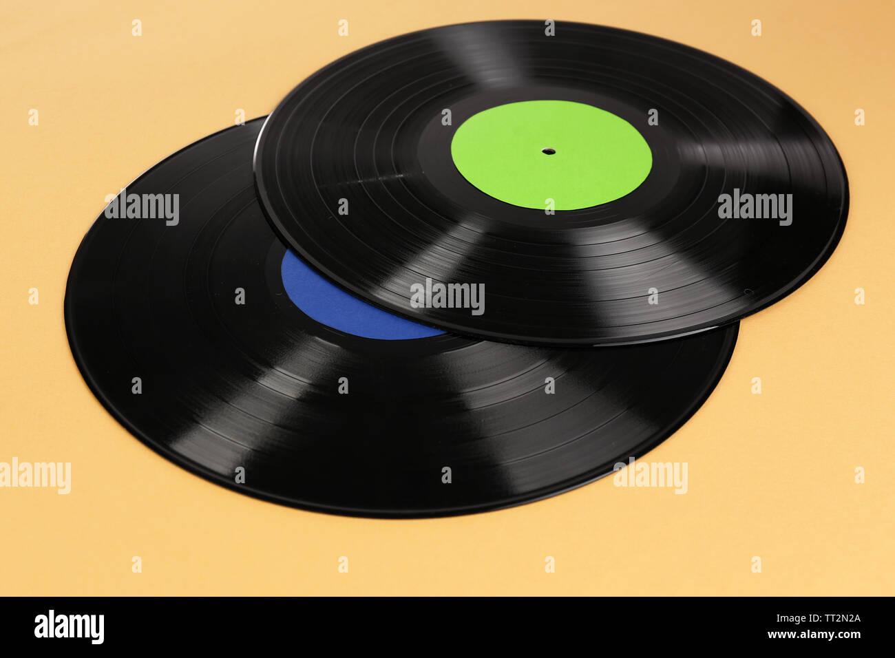 Old vinyl records on brown background Stock Photo - Alamy