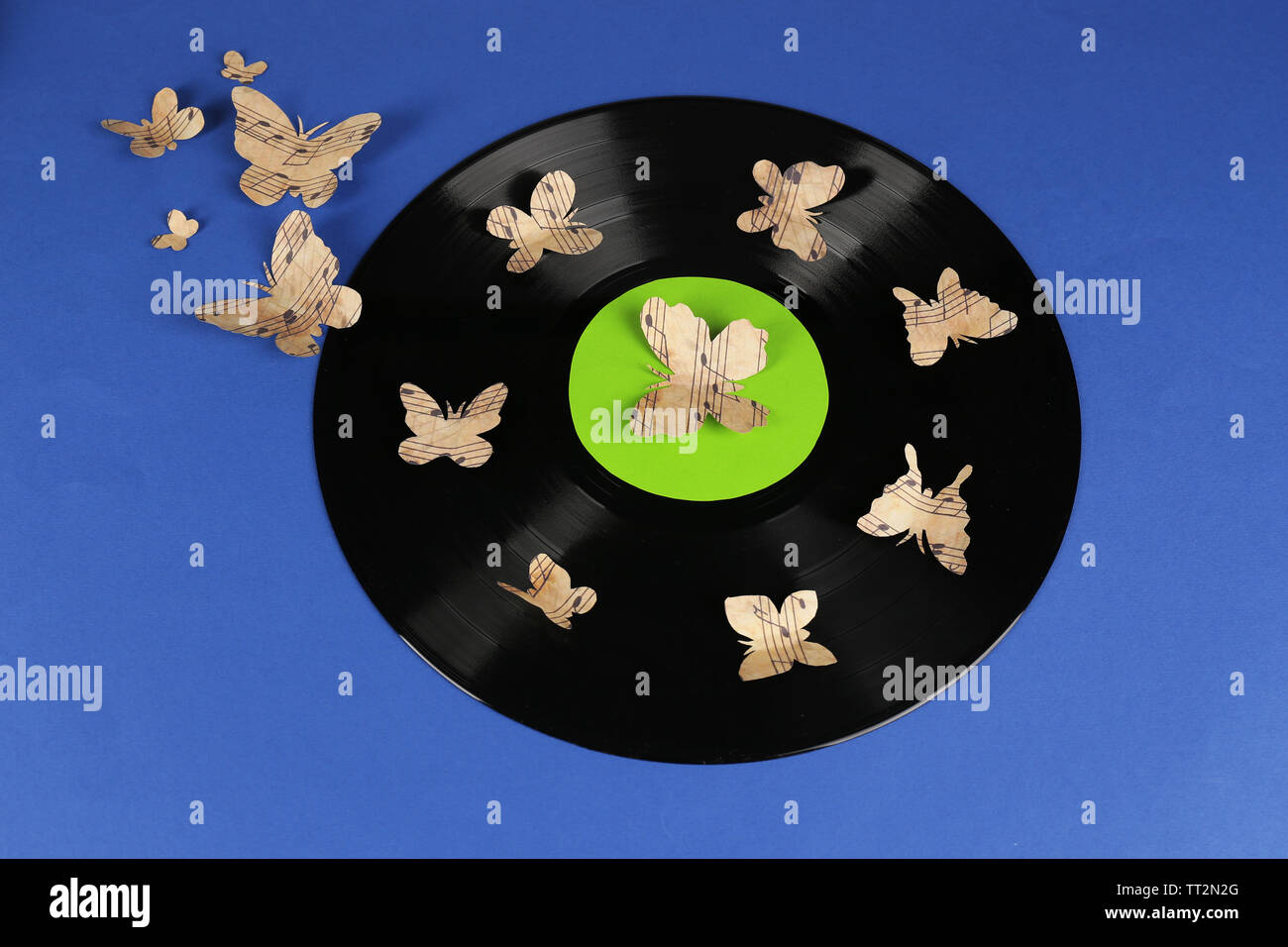 Old vinyl record with paper butterflies, on blue background Stock Photo ...