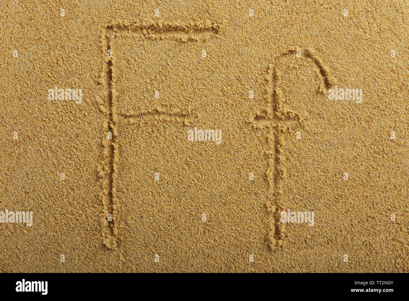 Alphabet letter written on wet beach sand Stock Photo - Alamy