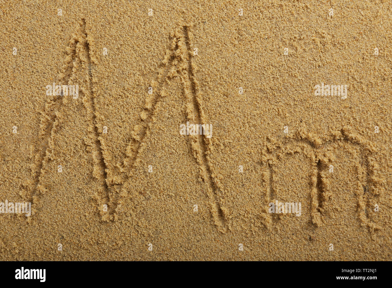 Alphabet letter written on wet beach sand Stock Photo - Alamy