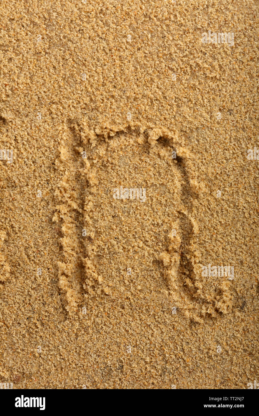 Alphabet letter written on wet beach sand Stock Photo - Alamy