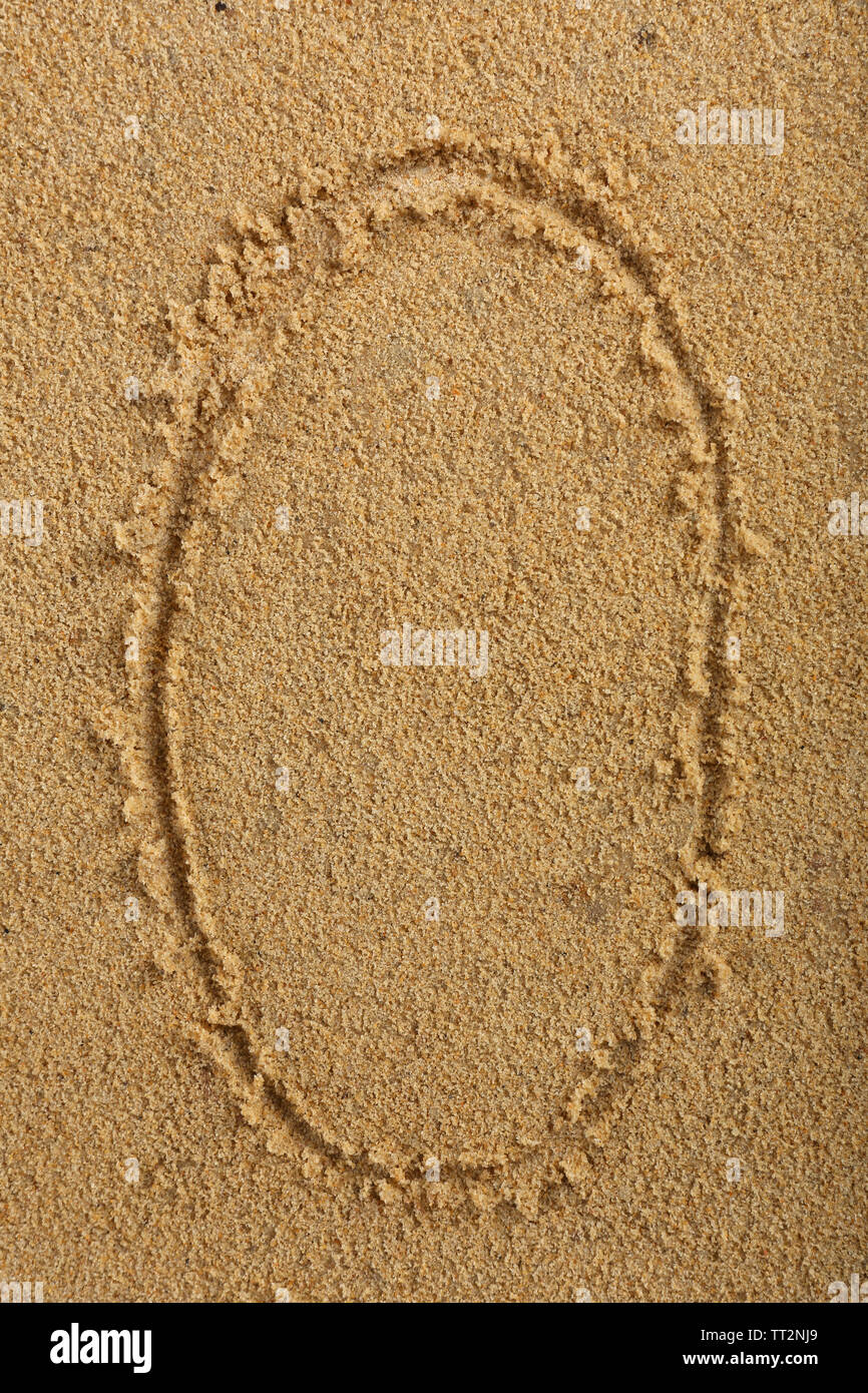 Alphabet letter written on wet beach sand Stock Photo - Alamy