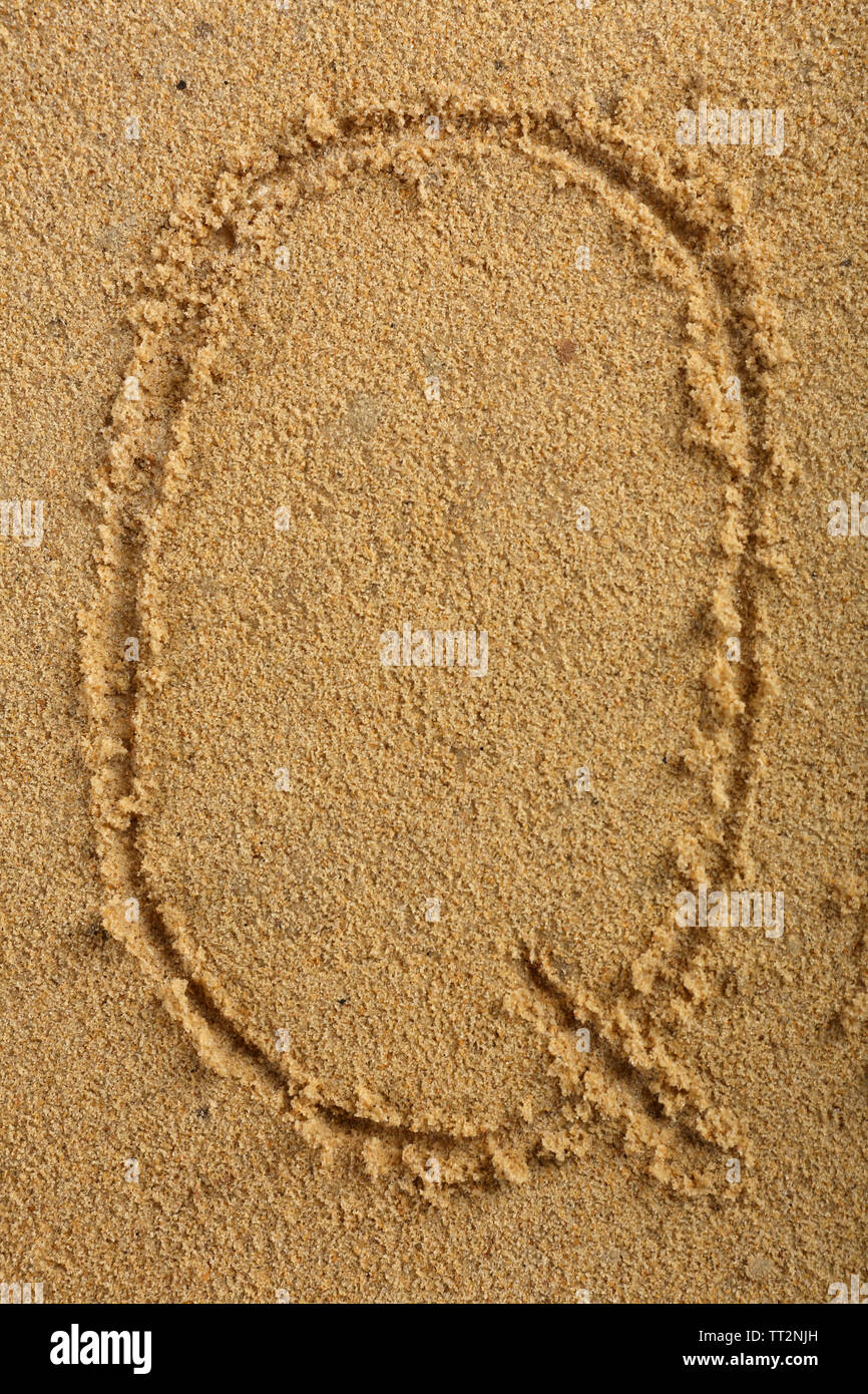 Alphabet letter written on wet beach sand Stock Photo - Alamy