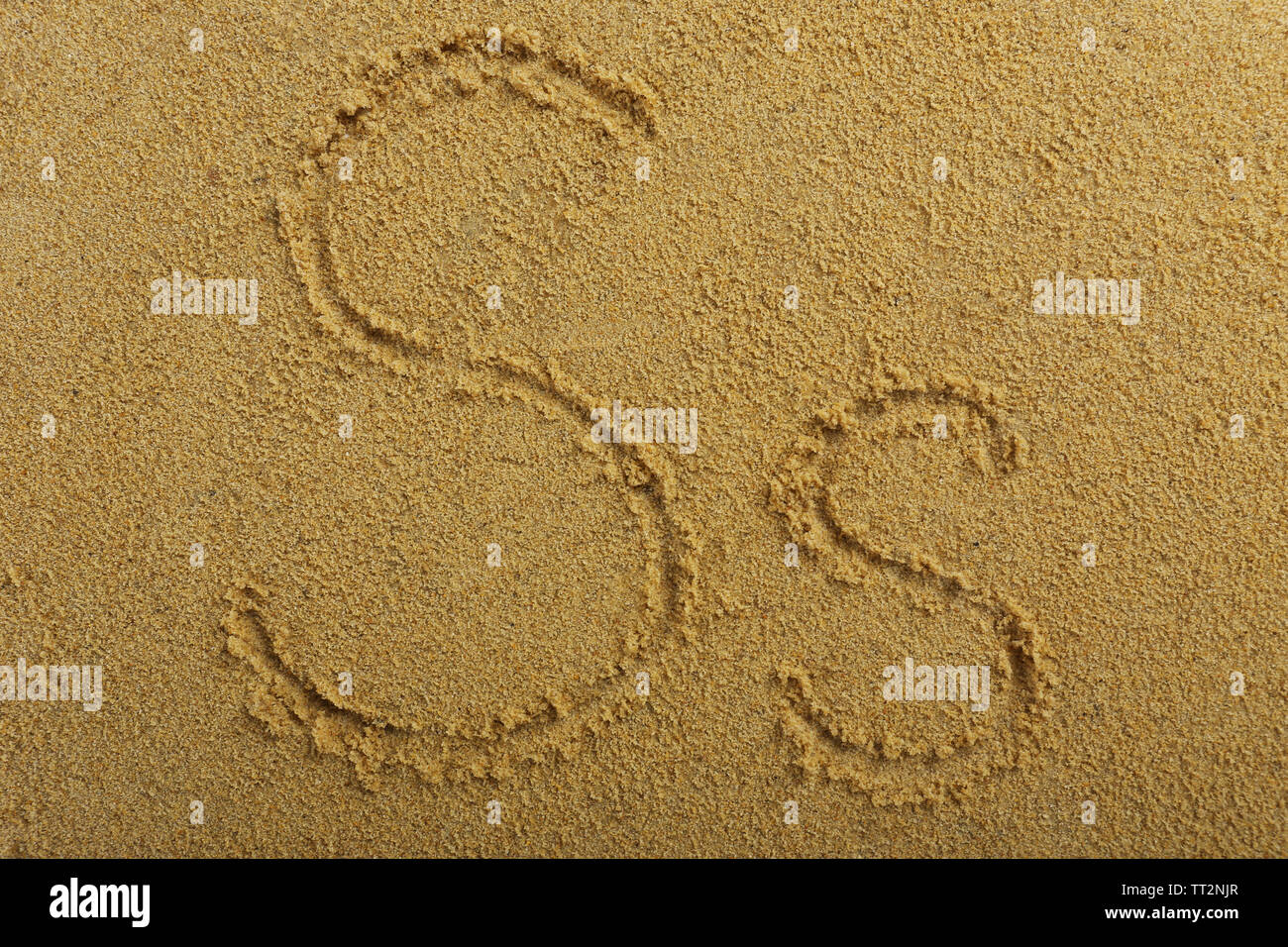 Alphabet letter written on wet beach sand Stock Photo - Alamy