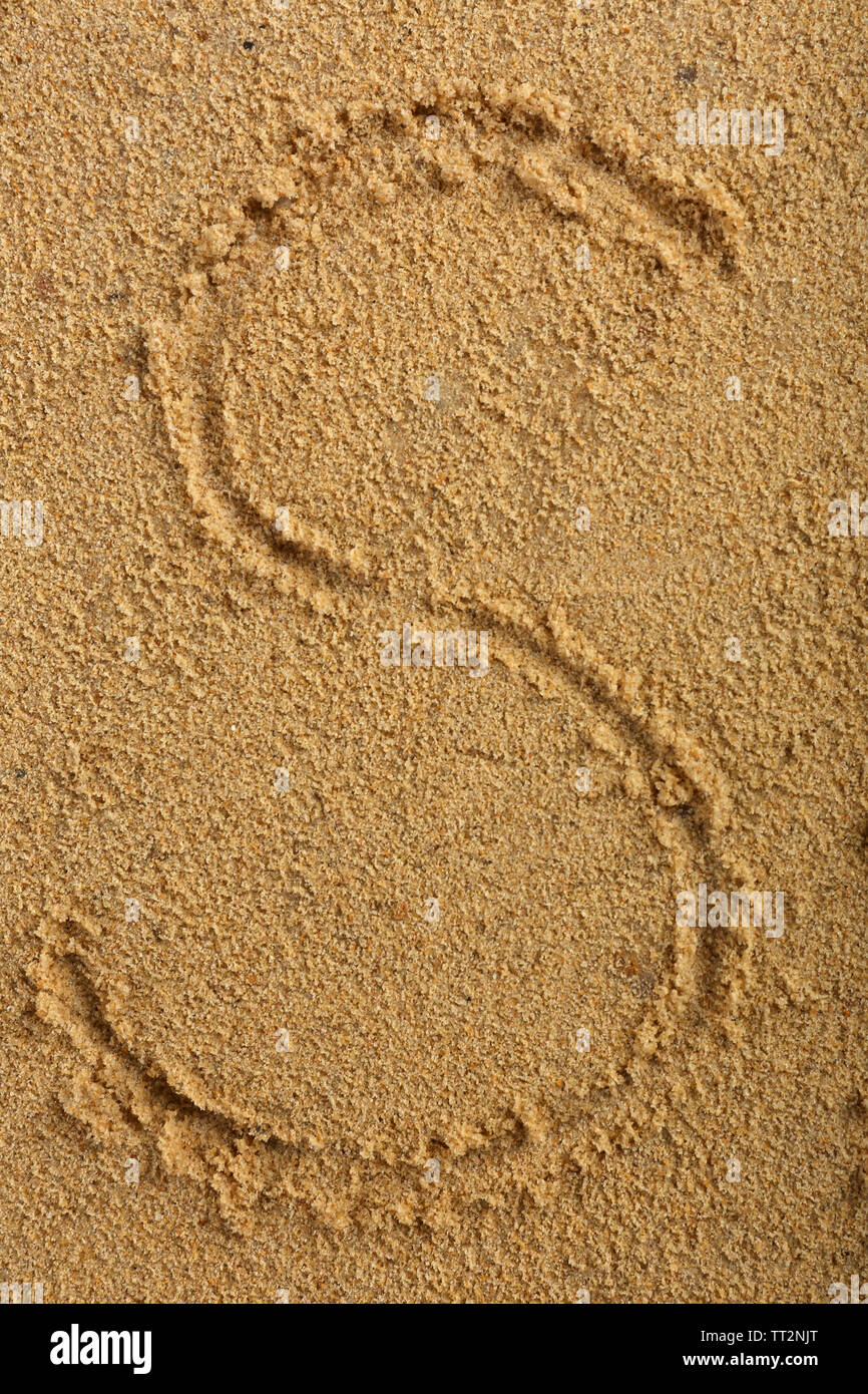Alphabet letter written on wet beach sand Stock Photo - Alamy
