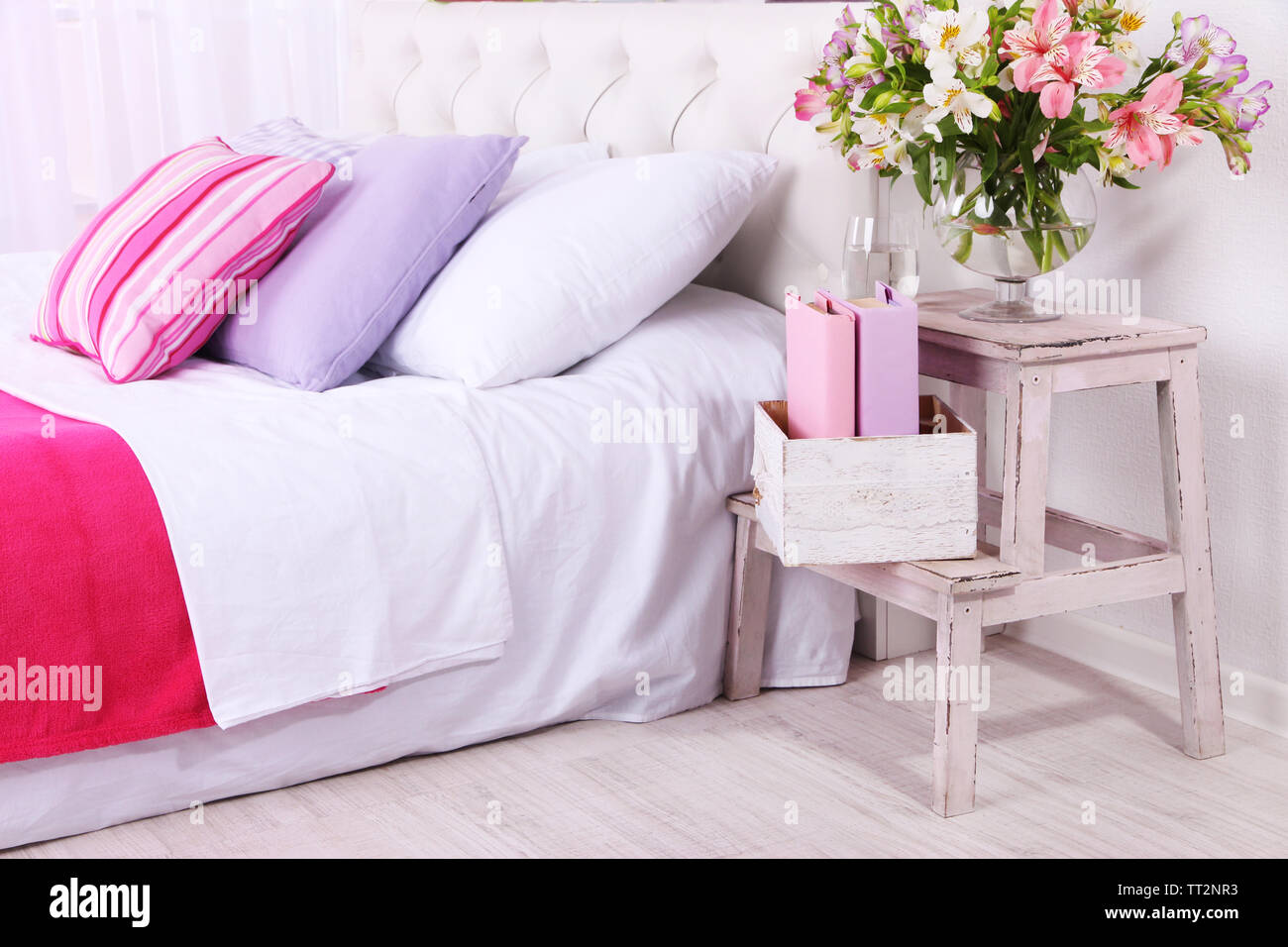 Comfortable soft bed in room Stock Photo - Alamy