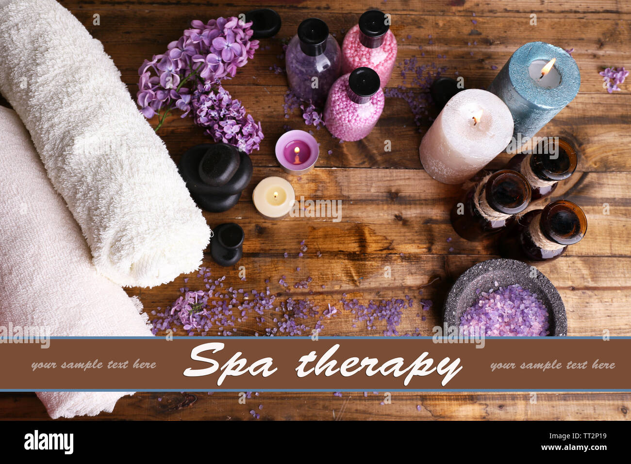 Composition with spa treatment, towels and lilac flowers, on wooden ...