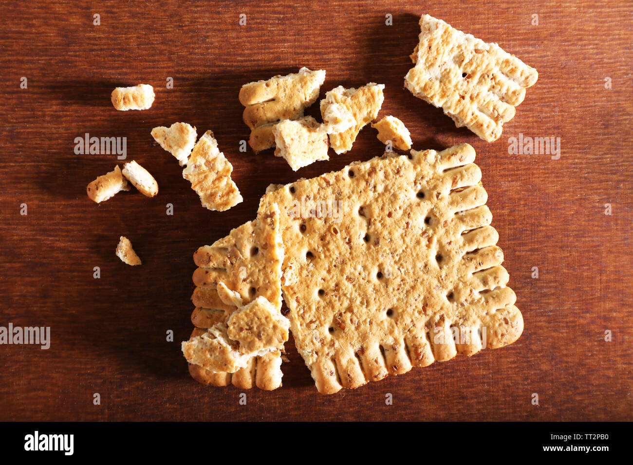 Crushed cookie on wooden background Stock Photo - Alamy