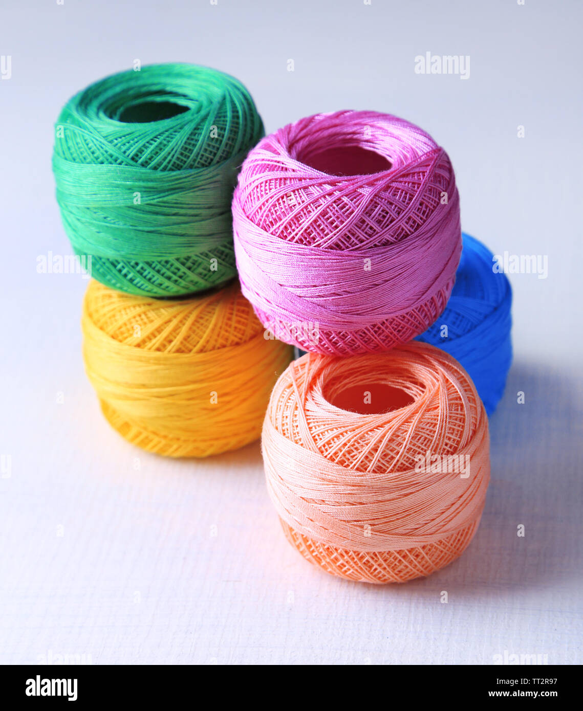 Colorful clews on light background Stock Photo - Alamy