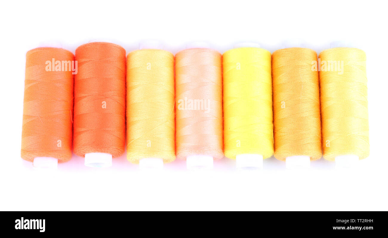 Multicolor sewing threads background isolated on white Stock Photo - Alamy