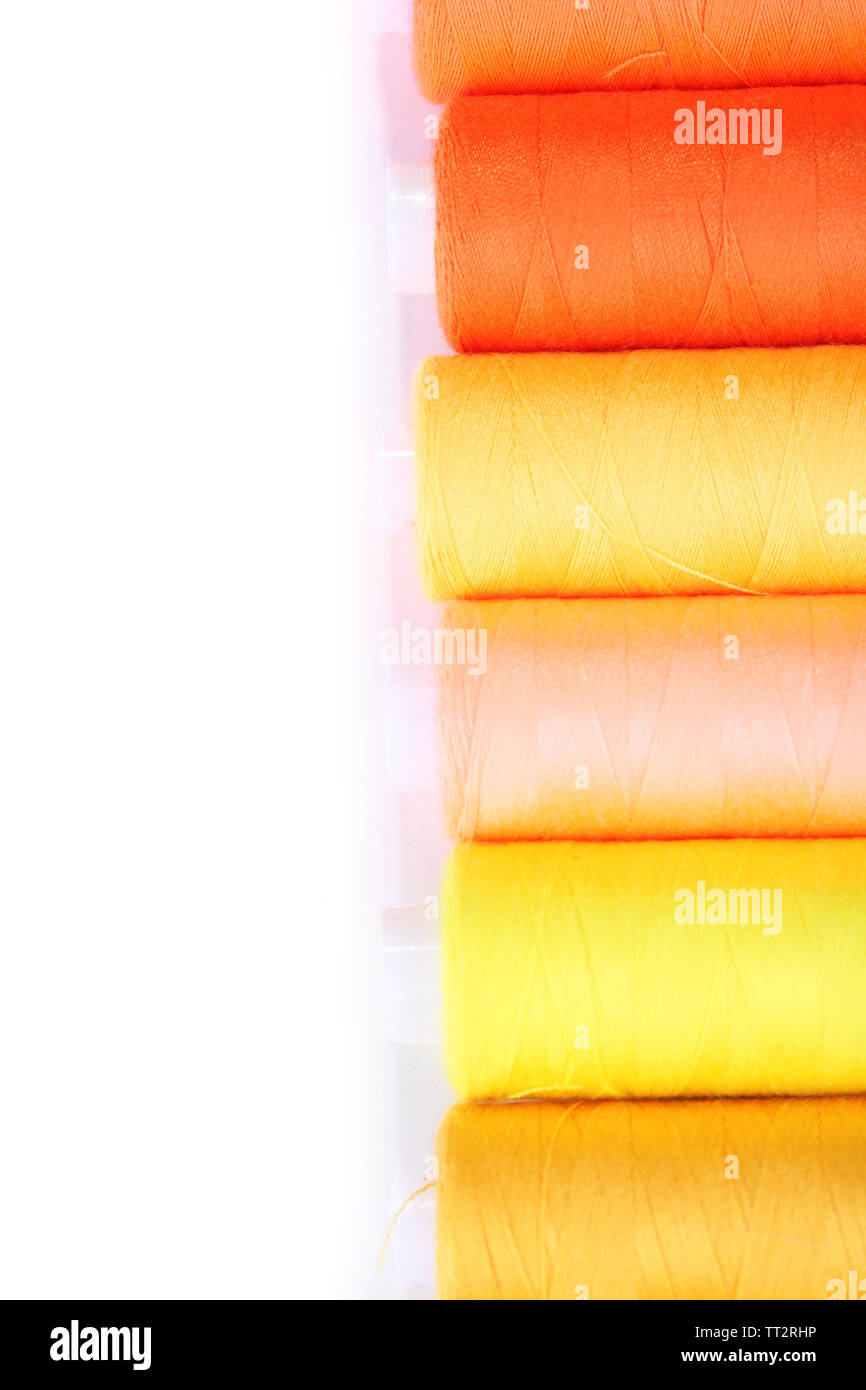 Multicolor sewing threads background isolated on white Stock Photo - Alamy