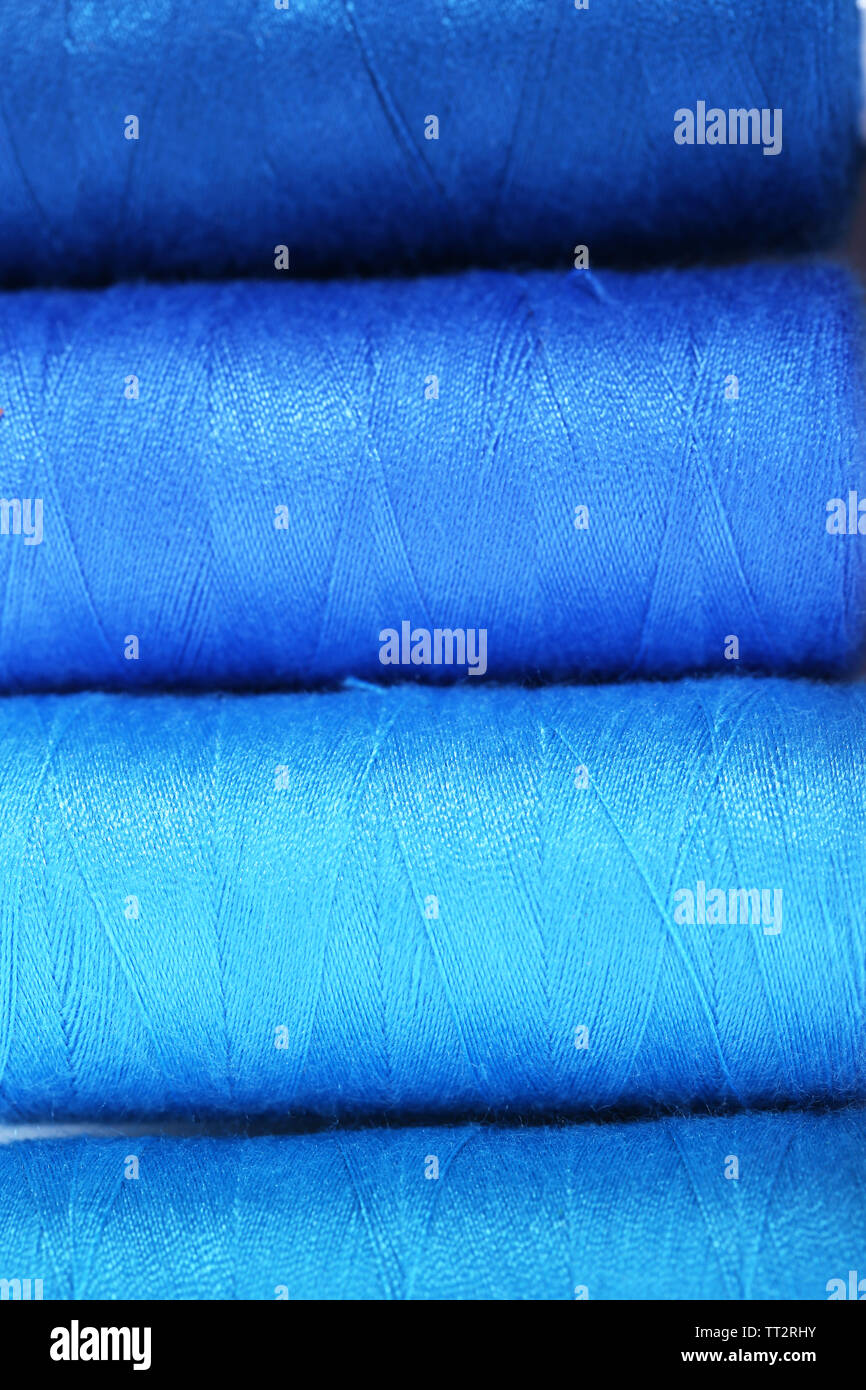 Colorful sewing threads background Stock Photo - Alamy