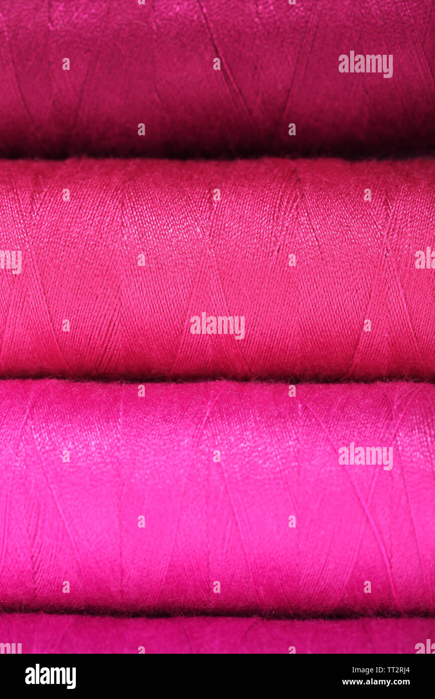 Colorful sewing threads background Stock Photo - Alamy