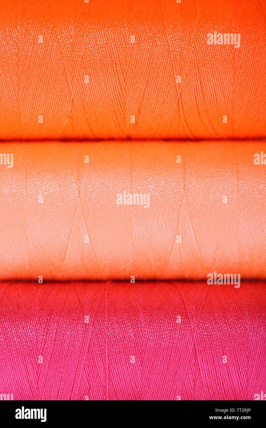 Multicolor sewing threads background Stock Photo - Alamy