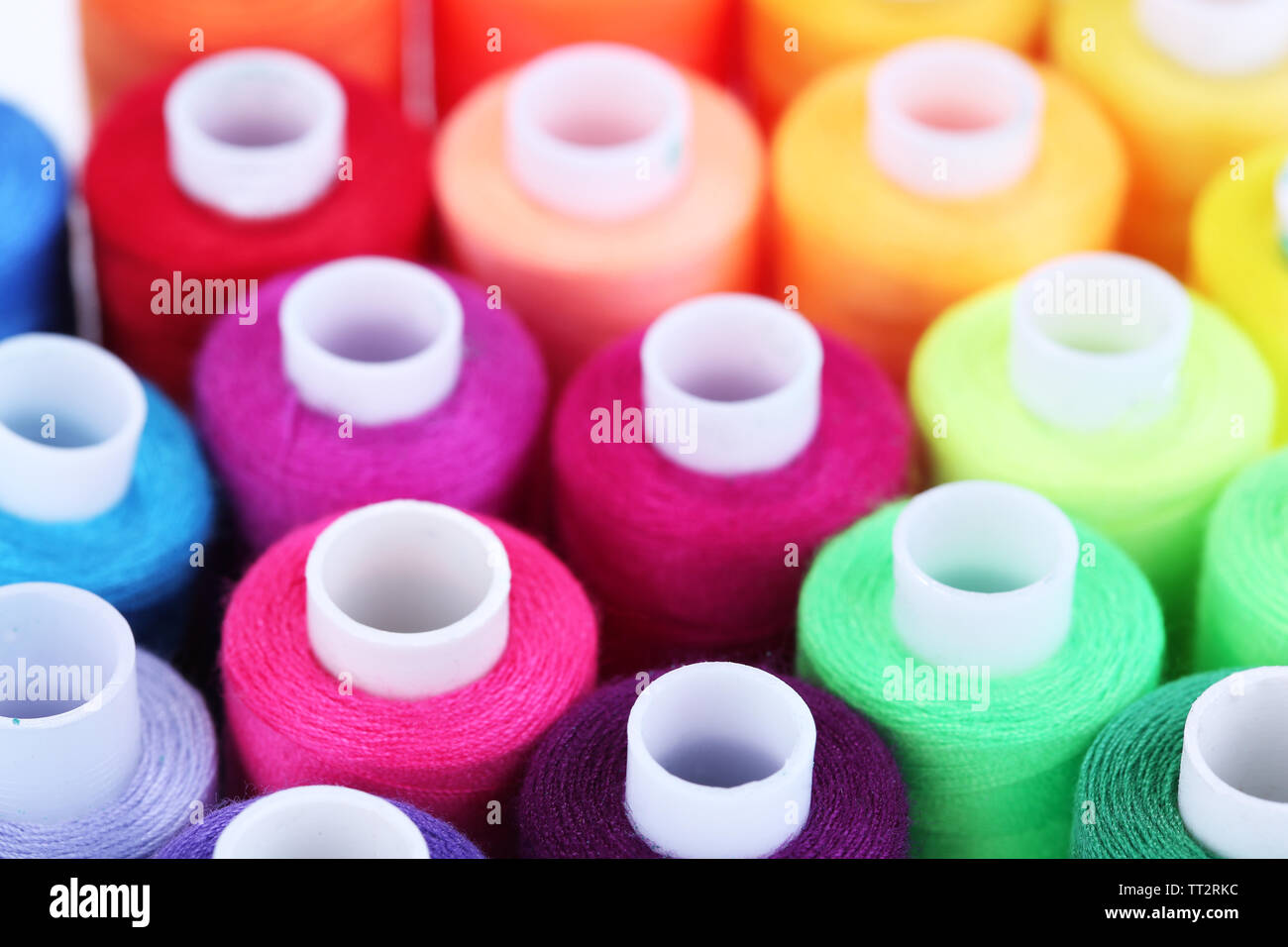 Multicolor sewing threads background Stock Photo - Alamy